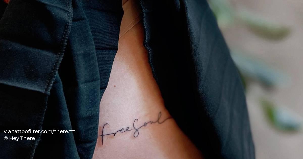 Tattoo that says "free soul" located on the pelvis.