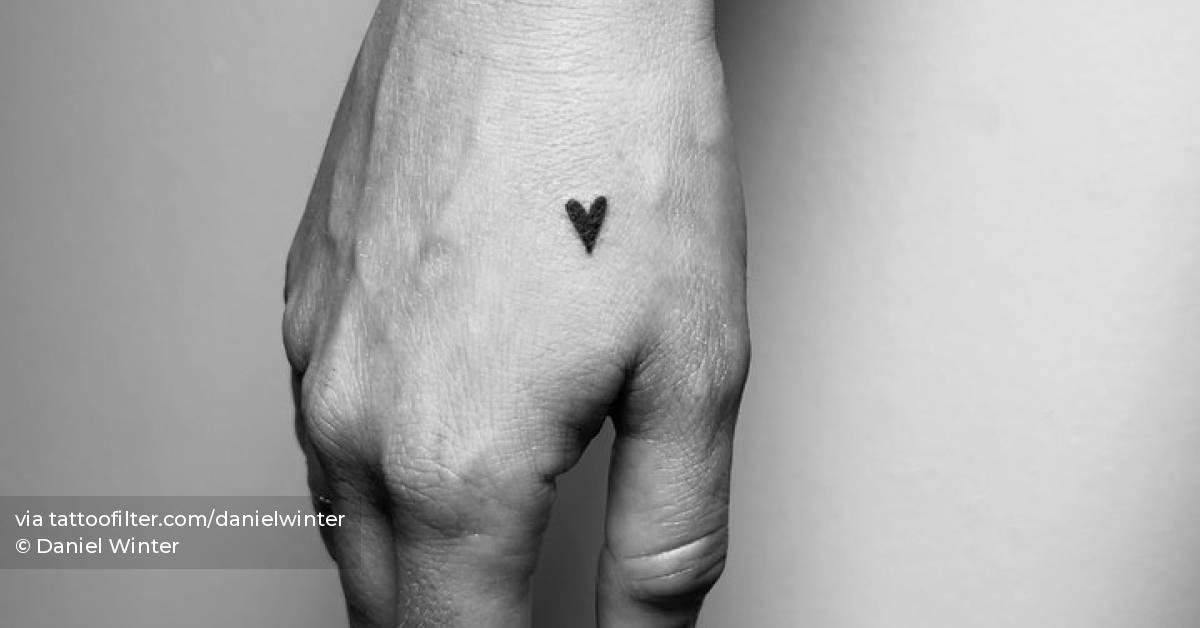 Heart tattoo done on the hand, minimalistic style.