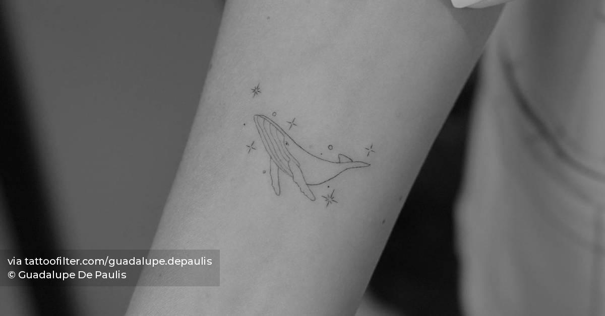 Fine line whale tattoo done on the inner forearm.