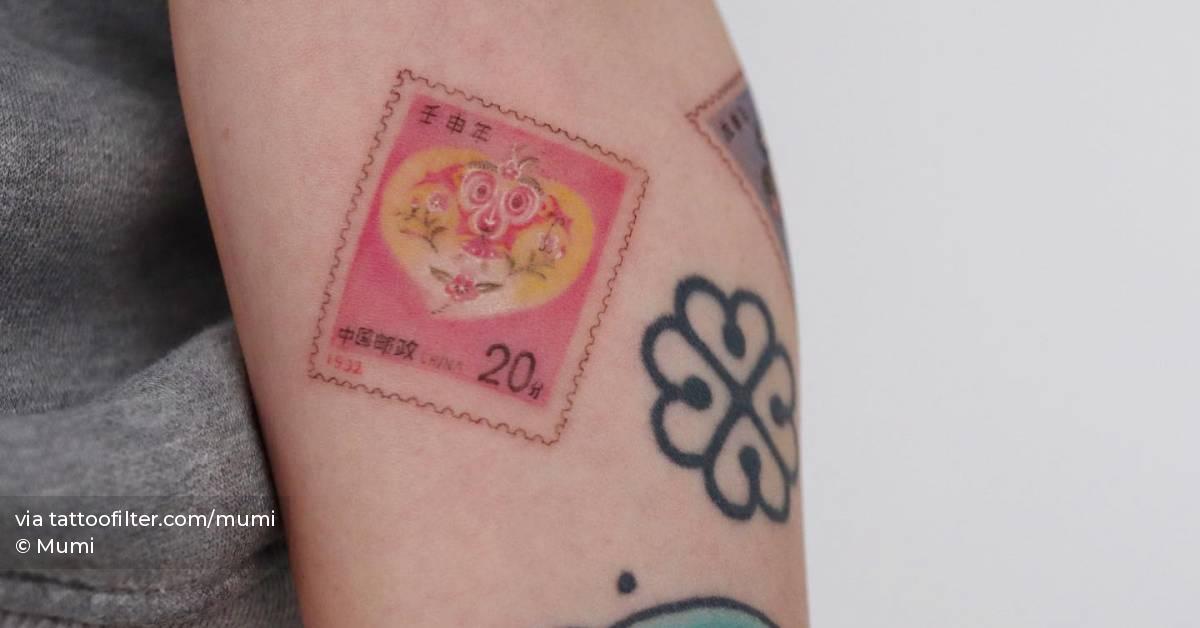 Micro-realistic stamp tattoo located on the inner