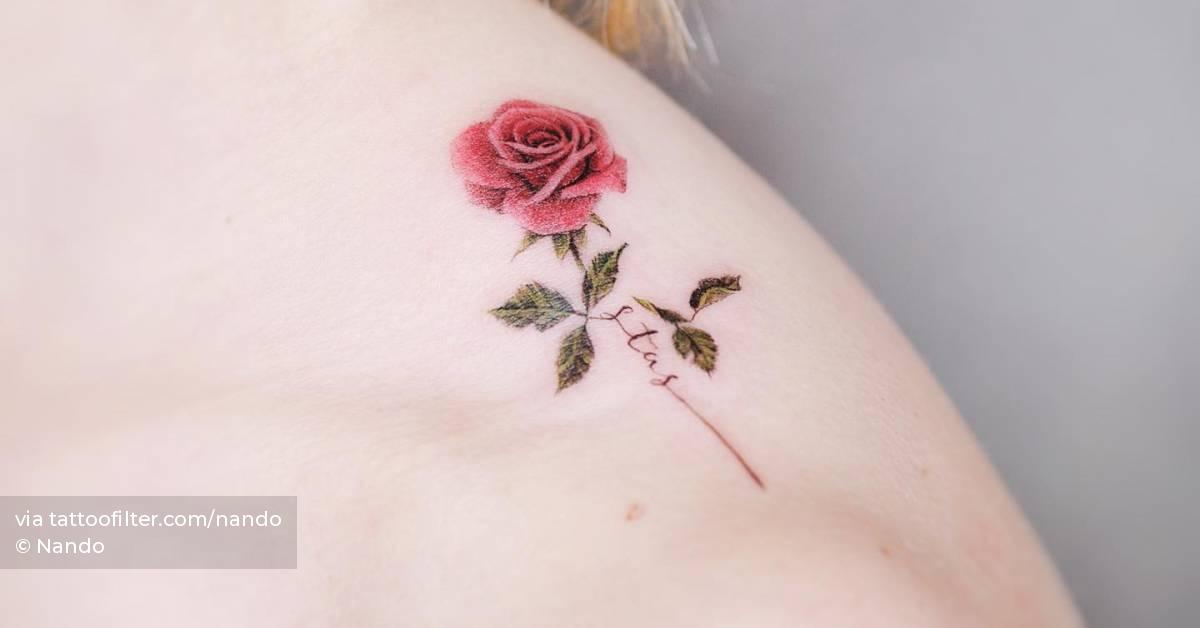 Micro-realistic red rose tattoo located on the top of