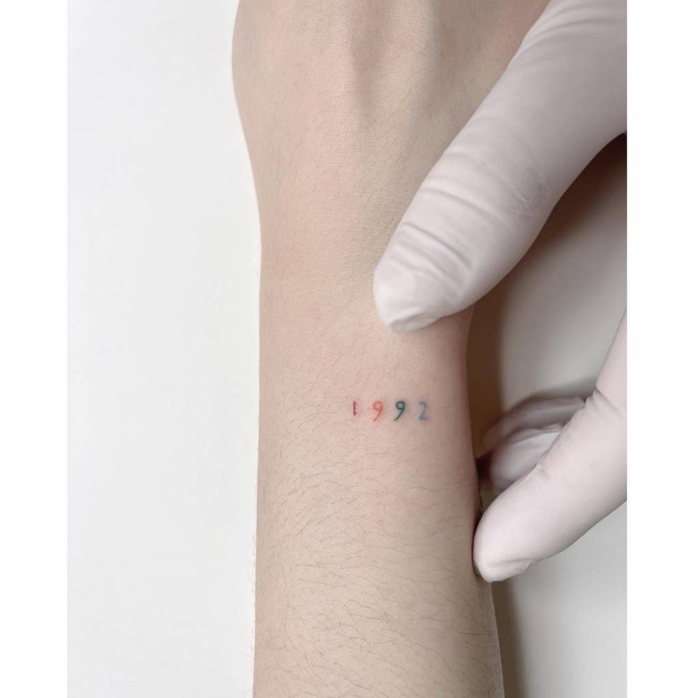 Colorful 1992 Lettering Tattoo Located On The Colorful 1992 Lettering Tattoo Located On The