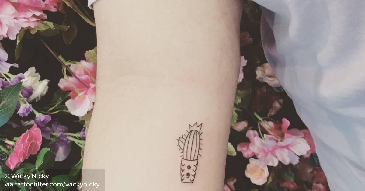 Fine line cactus tattoo on the inner forearm.