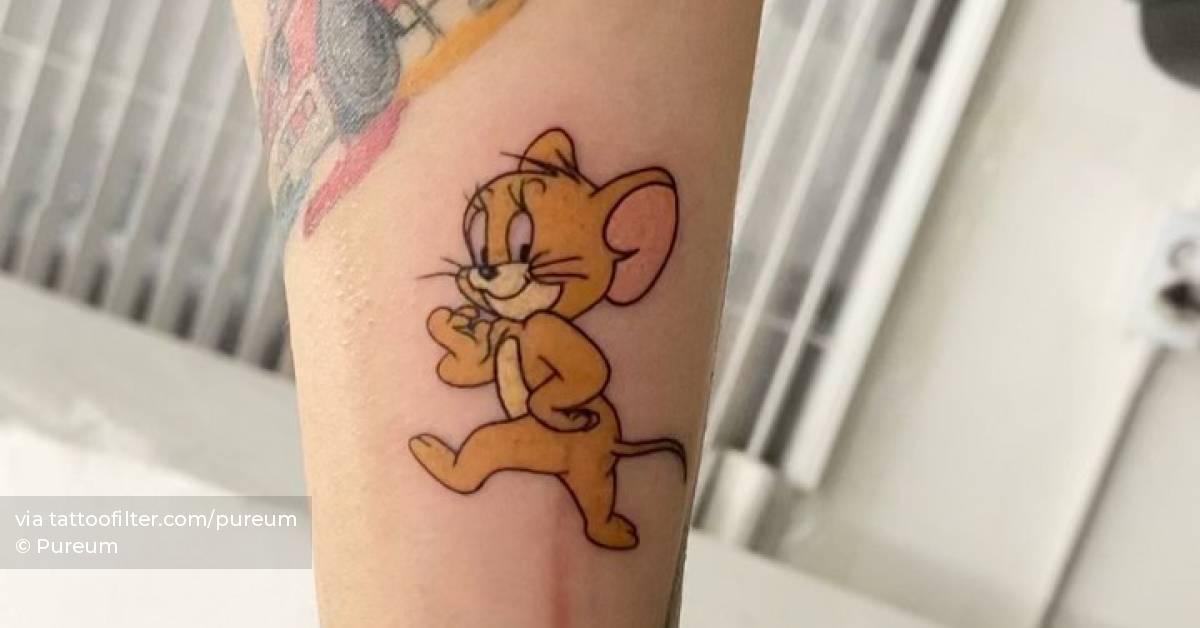 Cartoon style Jerry tattoo located on the inner