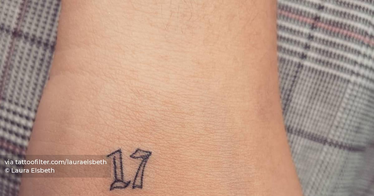 Hand poked number "17" tattoo done on the hand.