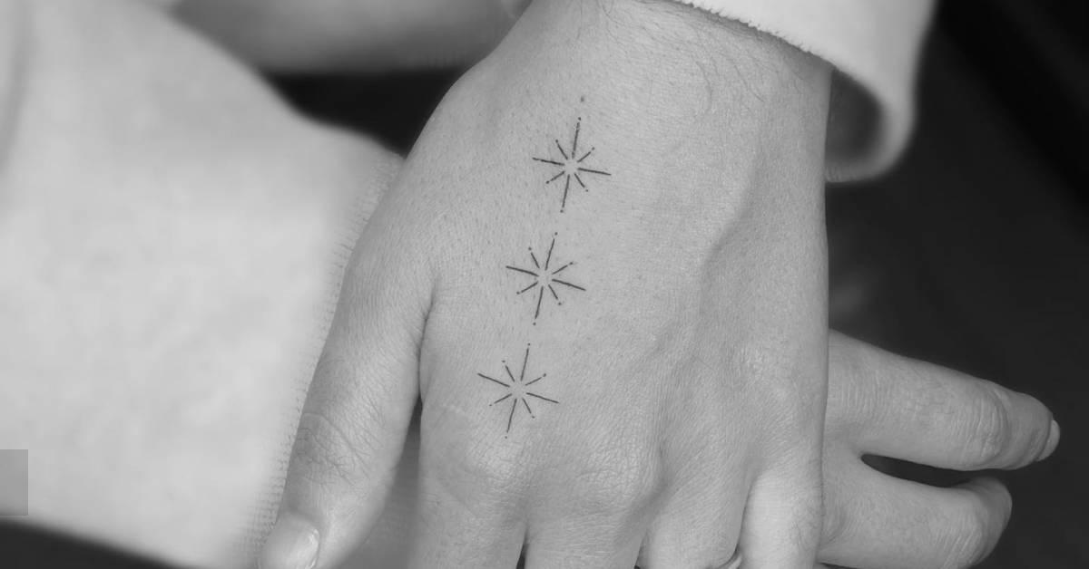 Minimalistic stars tattooed on the hand, fine line