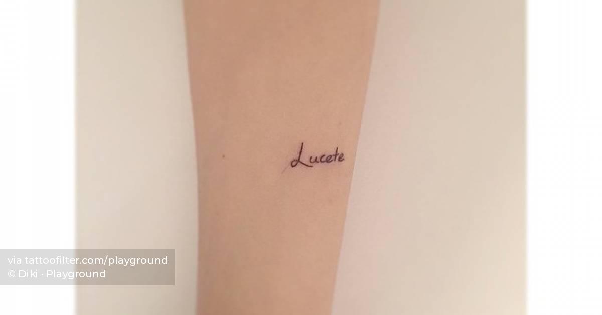 Tattoo of the word "lucete" located on the inner