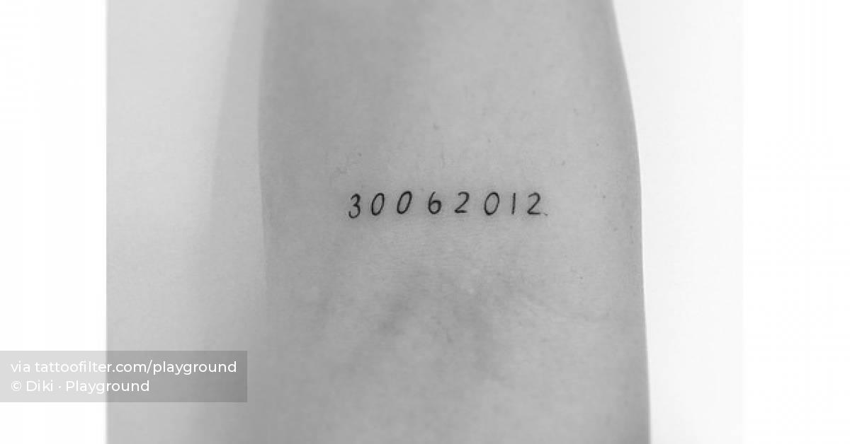 Date tattoo done on the inner forearm.