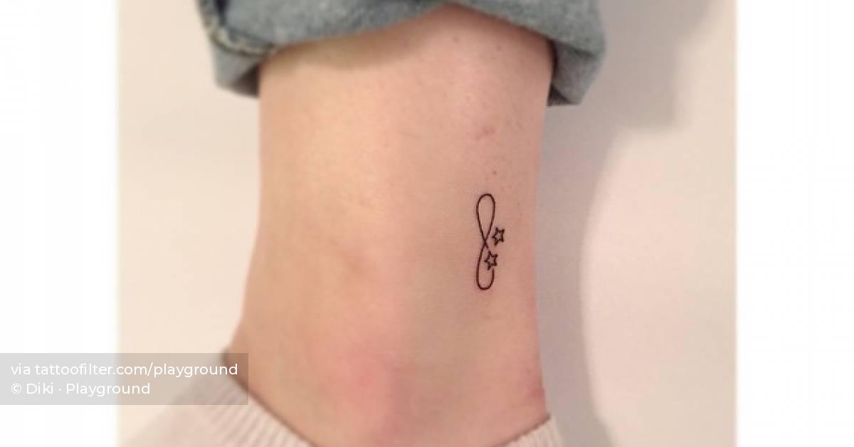 Infinity symbol and stars tattooed on the ankle.