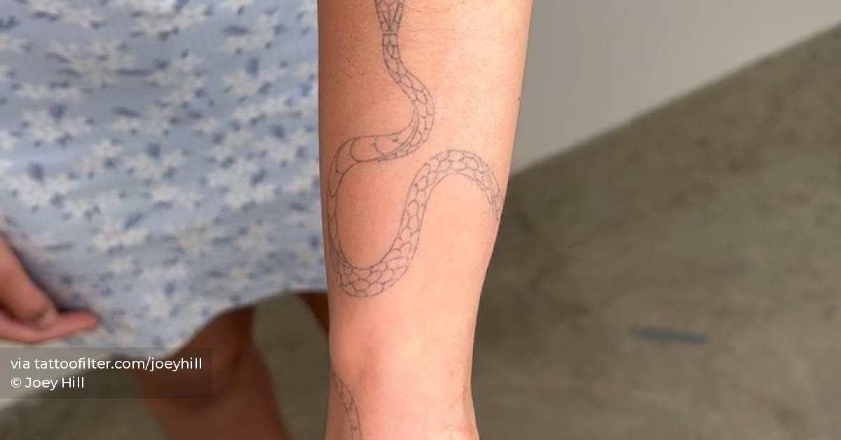 Healed snake bracelet tattoo done in fine line.