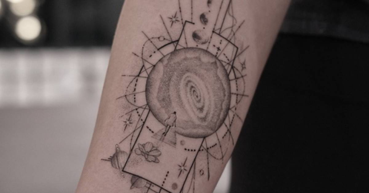 Graphic style universe themed tattoo located on the