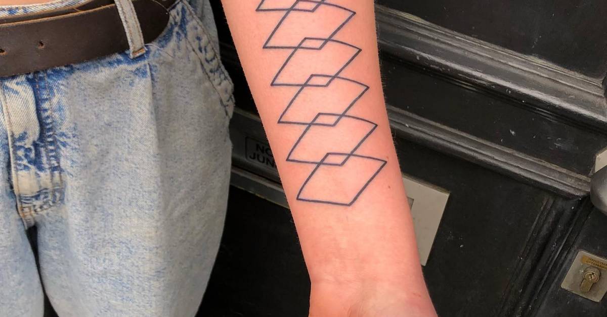 Abstract squares tattoo done on the inner forearm.