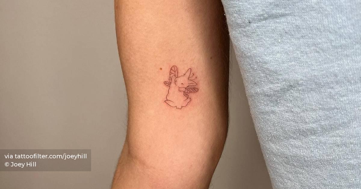 Single needle rabbit tattoo located on the inner arm.