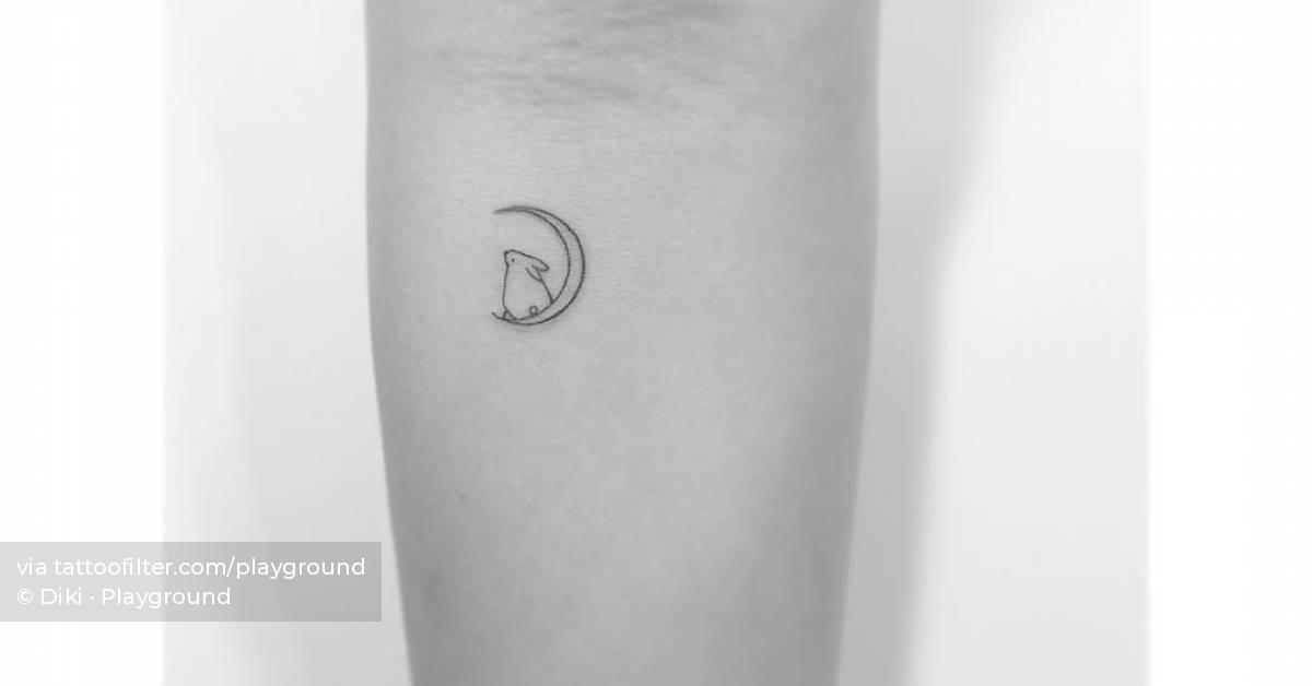 Fine line moon and rabbit tattoo located on the inner