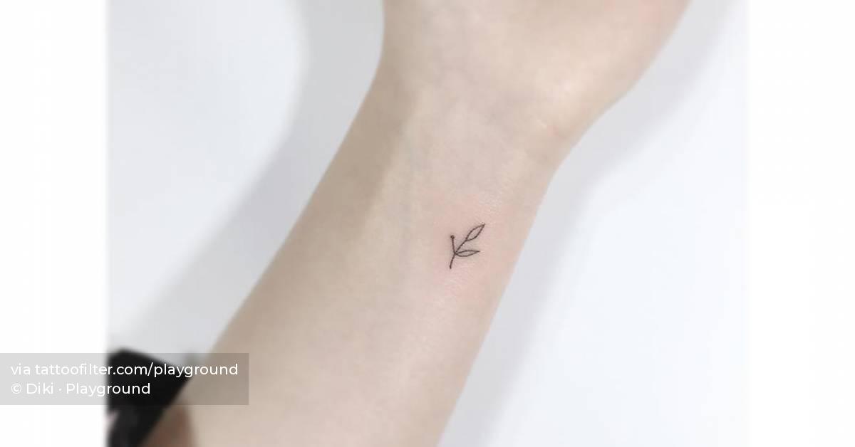 Tiny leaves tattoo located on the wrist, minimalistic