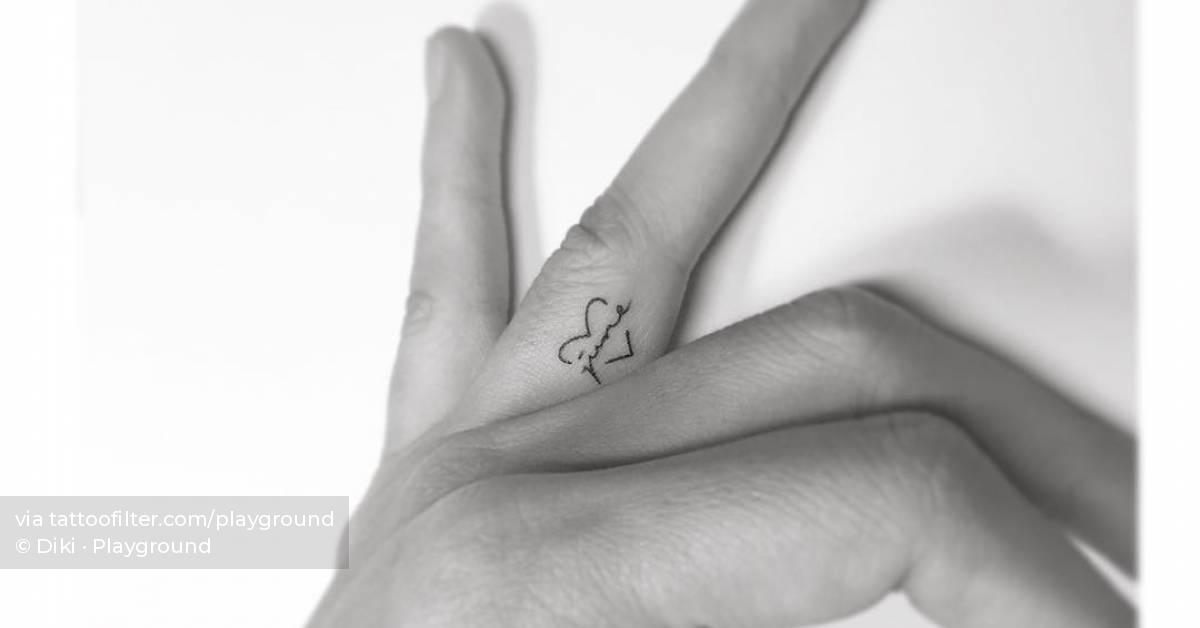 Tattoo of the name "June" inside a heart.