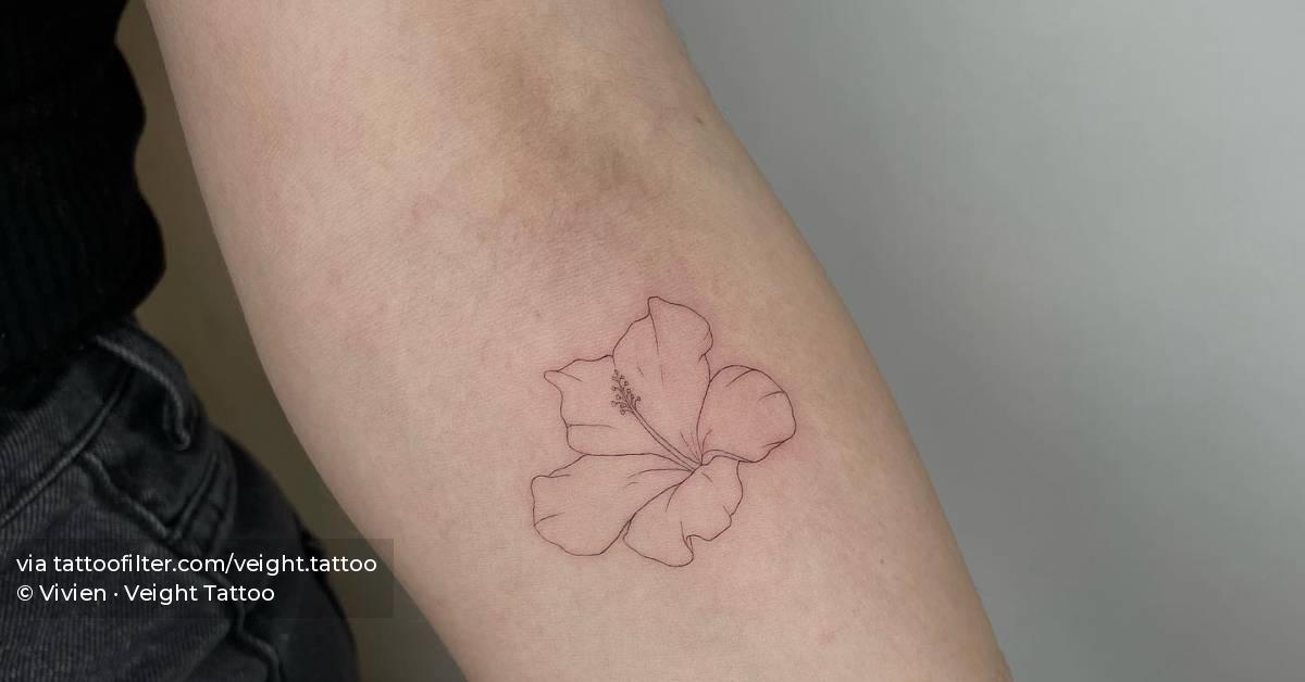 Fine line style hibiscus flower tattoed on the inner
