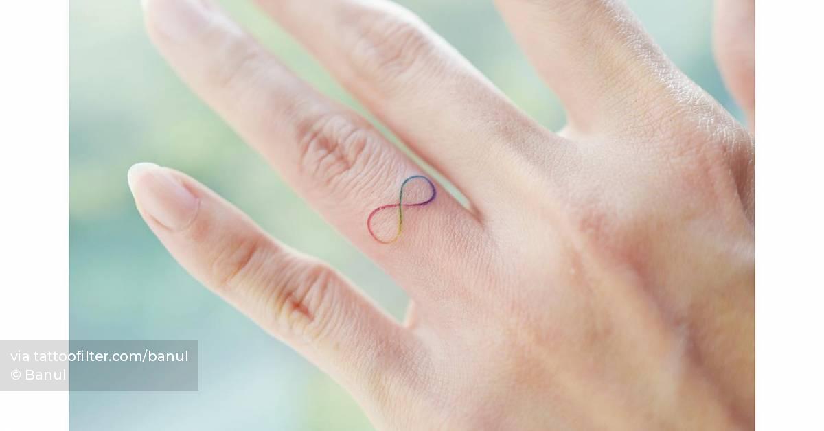 Mini infinity symbol tattoo located on the finger.