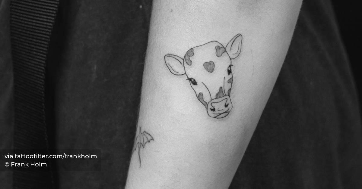 Cow tattoo located on the forearm.
