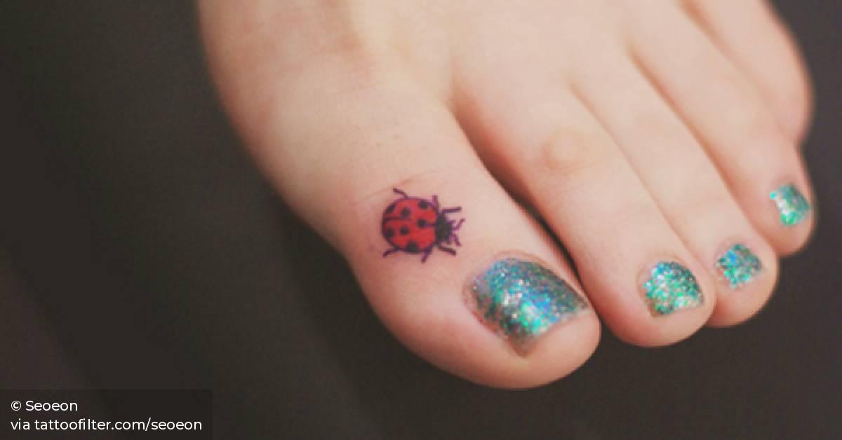 Small ladybug tattoo on the toe.