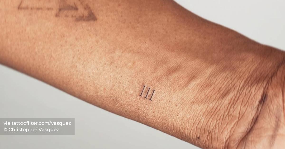 Tattoo of the number "111" Woody McClain's wrist.