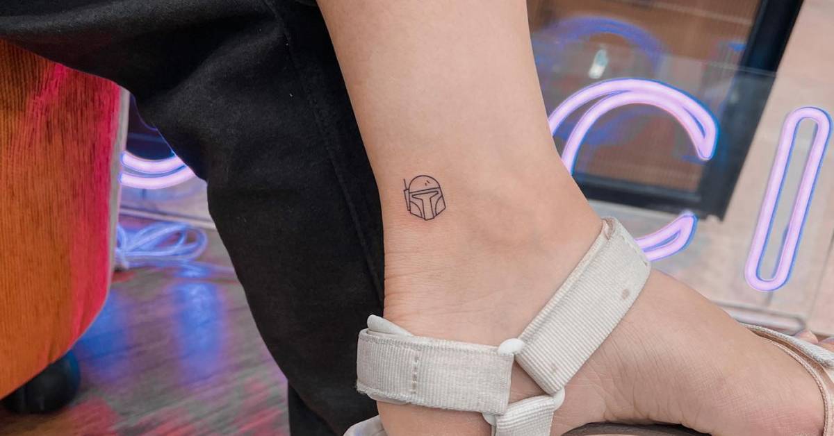 Fine line Stormtrooper tattoo located on the ankle.