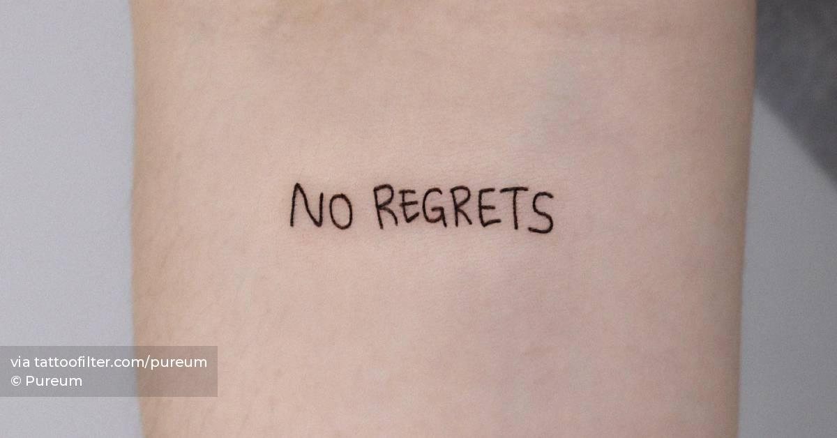 "No regrets" lettering tattoo located on the inner