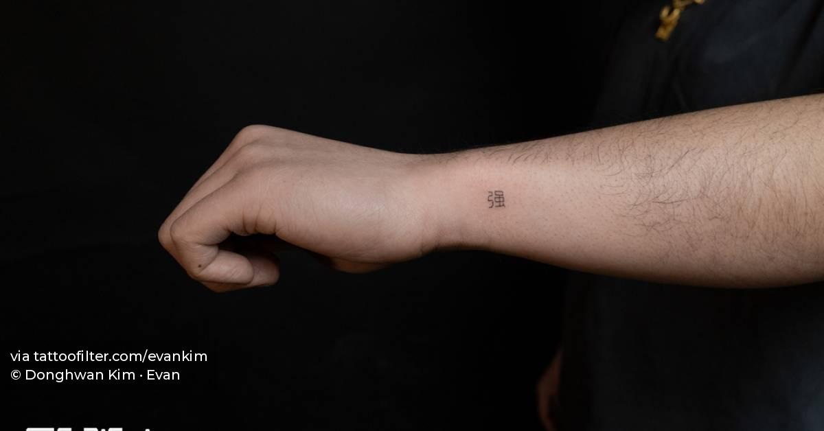 Chinese character tattoo located on the wrist.