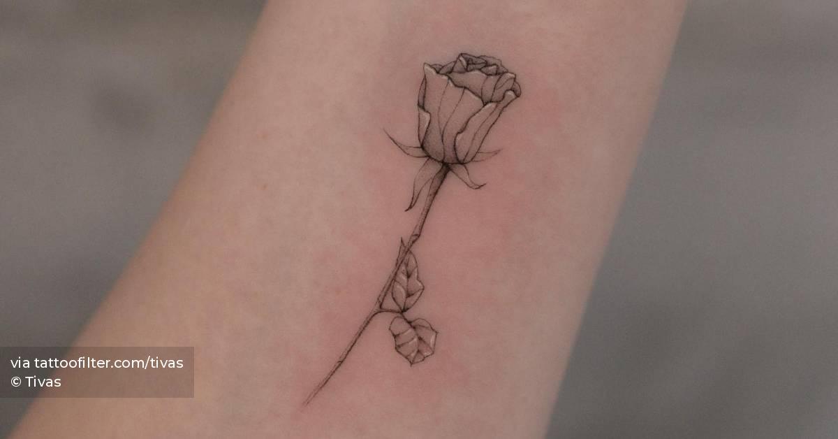 Micro-realistic rose tattoo located on the inner