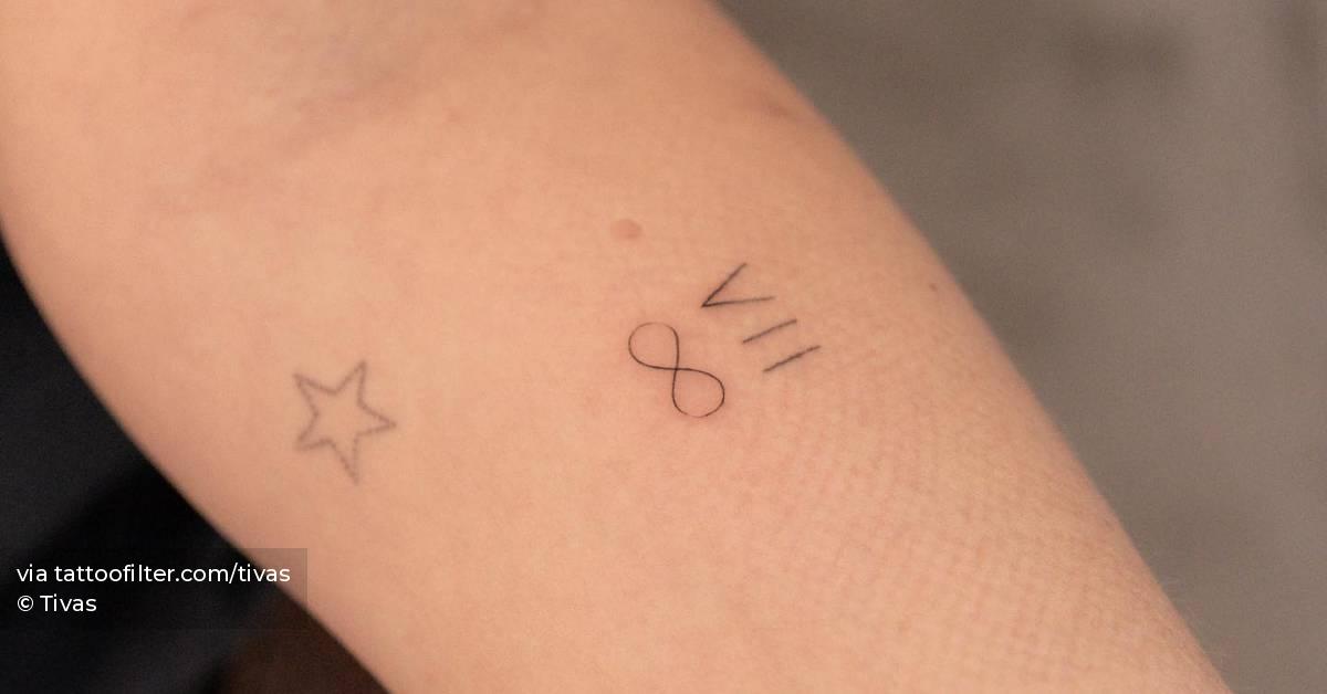Roman numeral and infinity symbol tattooed on the inner