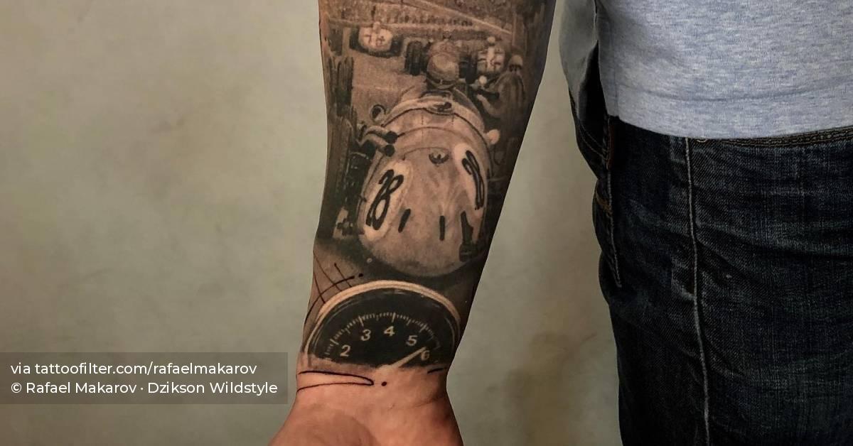 Formula One themed black and grey tattoo located on the