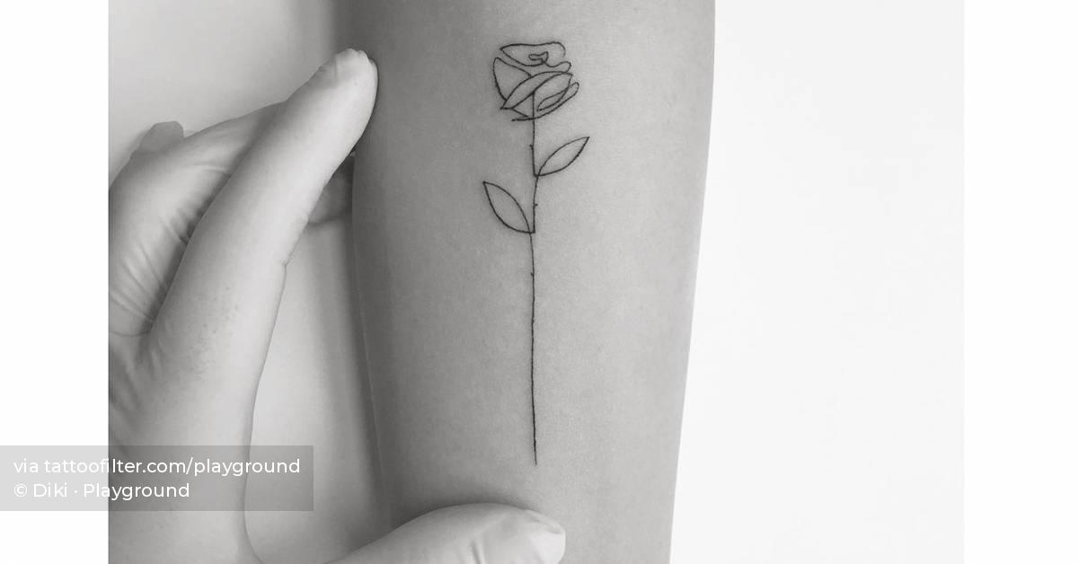 One line rose tattoo located on the inner forearm.