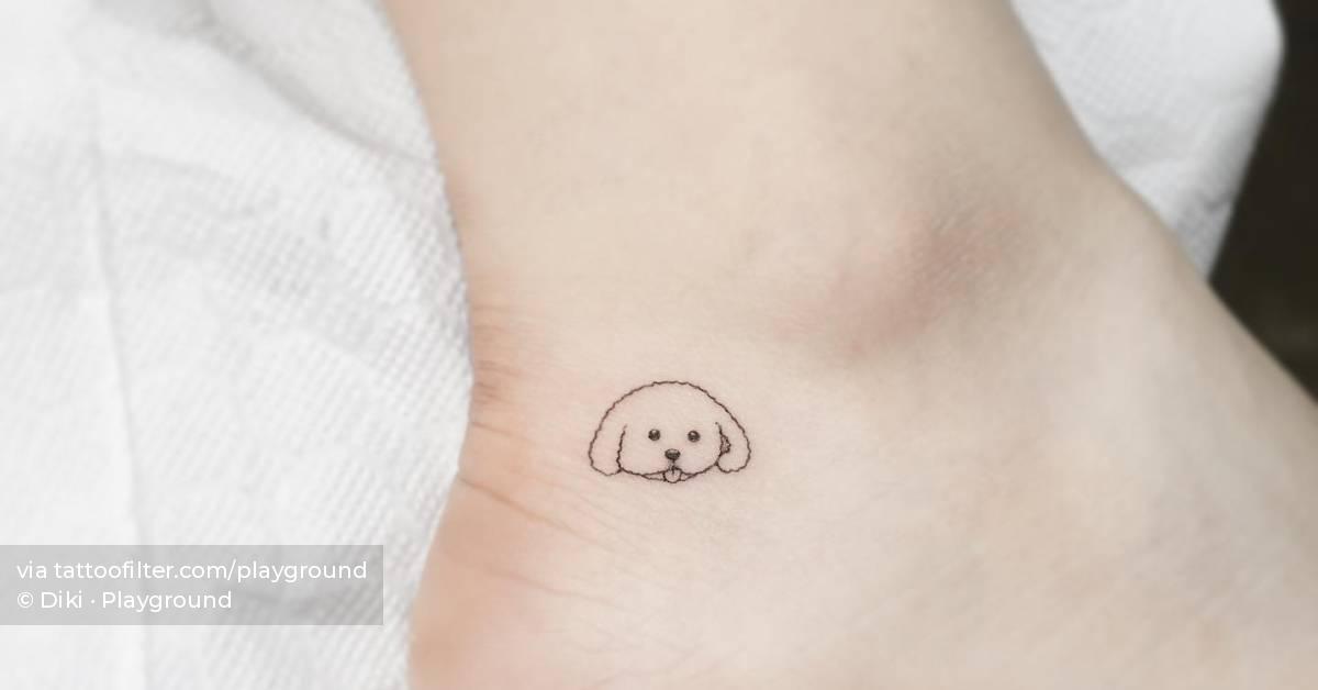 fine line dog portrait tattooed on the ankle.