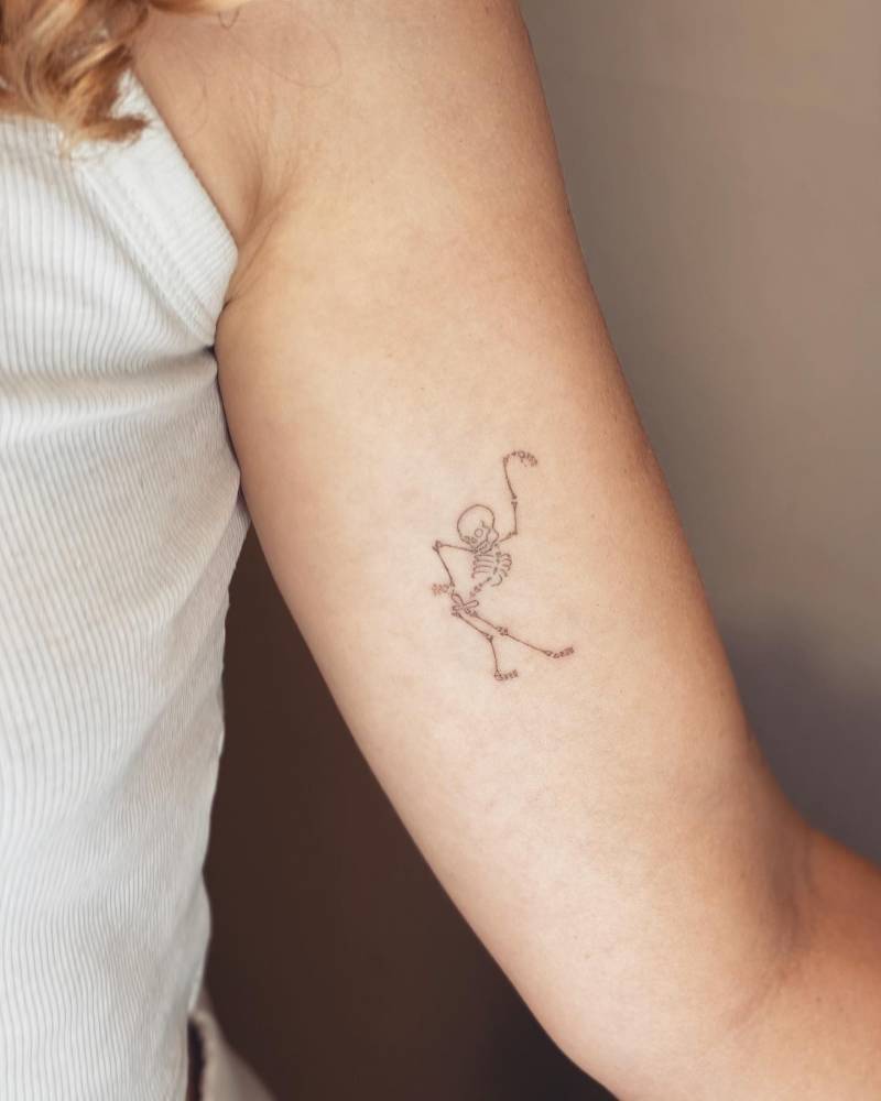 SIngle Needle Dancing Skeleton Tattoo Located On The SIngle Needle Dancing Skeleton Tattoo Located On The