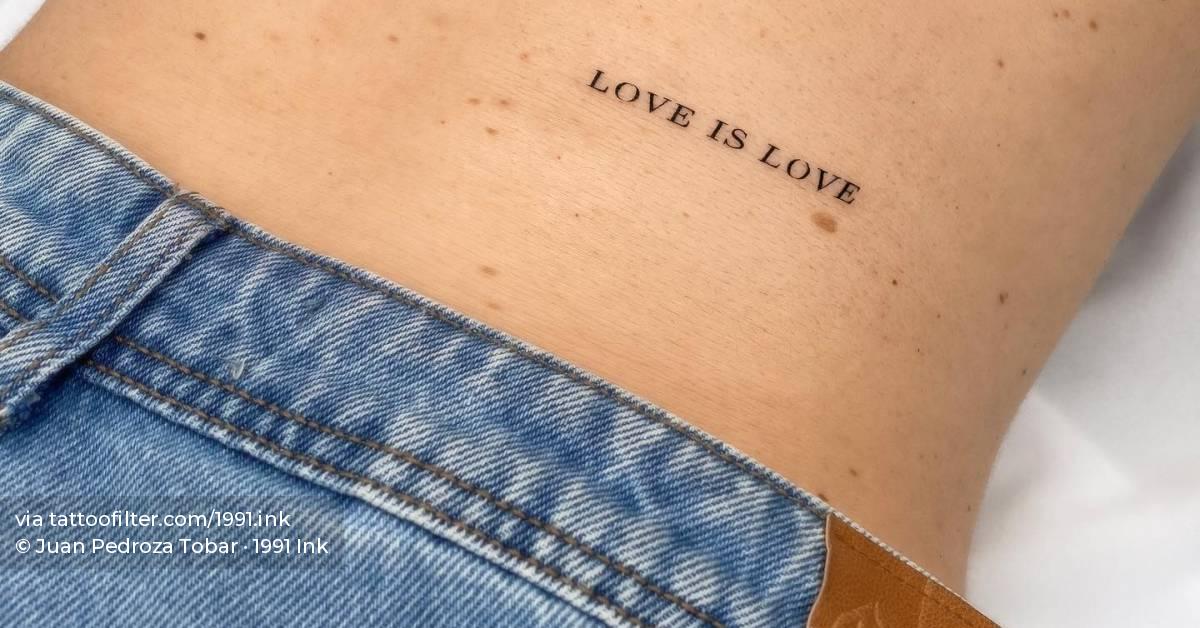 Tattoo that says "love is love" located on the lower