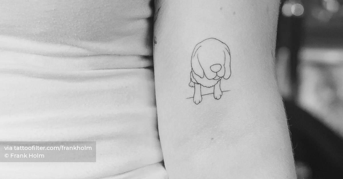 Tattoo of a dog done in fine line, located on the