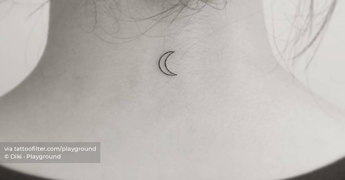 Minimalistic crescent moon tattoo done at the back of