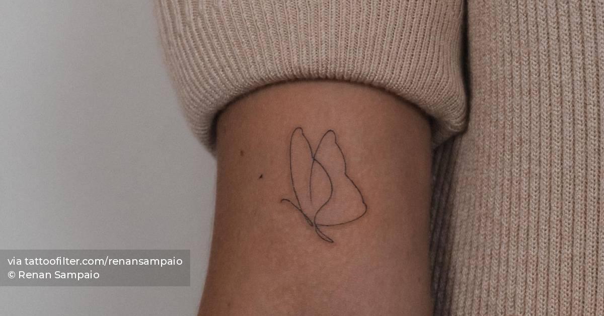 One line butterfly tattoo done on the bicep, fine line