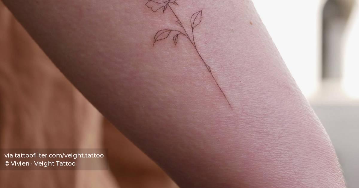Fine line rose tattoo located on the wrist.