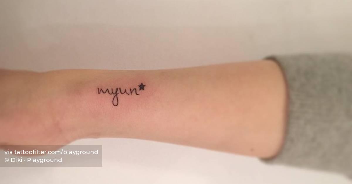 Tattoo of the name Myun located on the wrist.