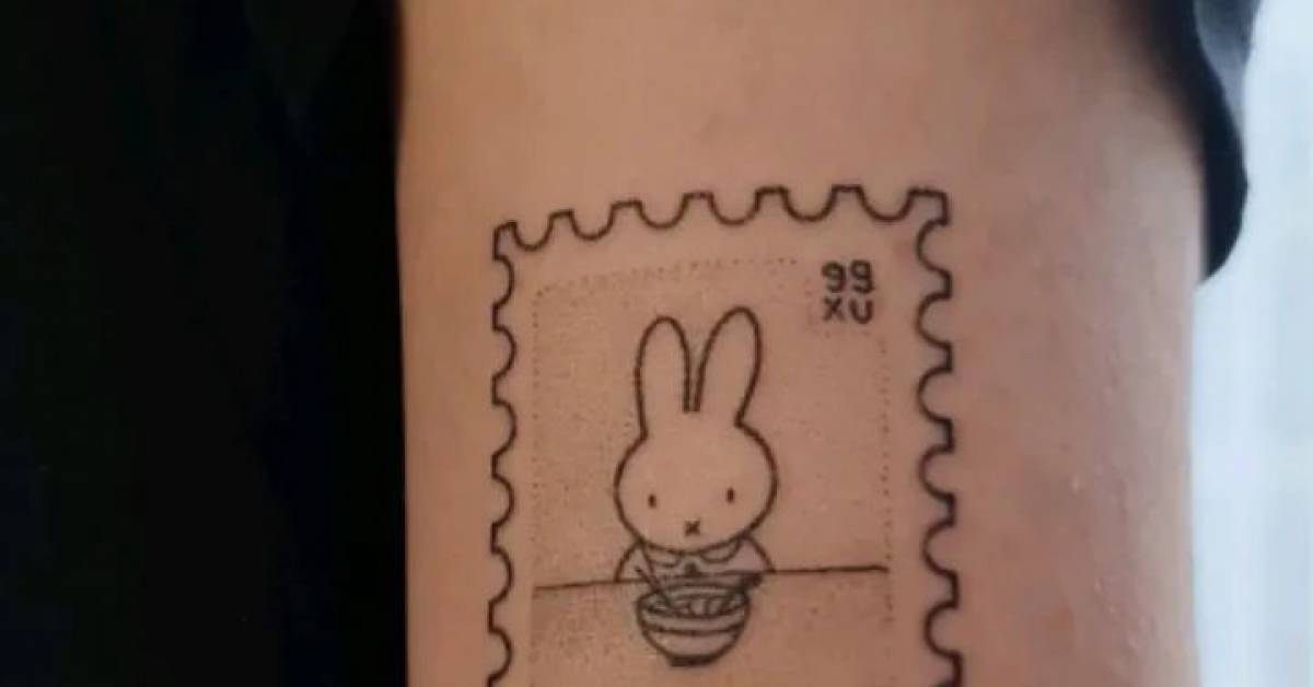 Miffy stamp tattoo hand poked on the tricep.