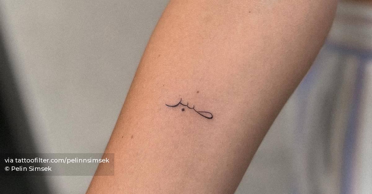 Arabic lettering tattoo done on the inner forearm.