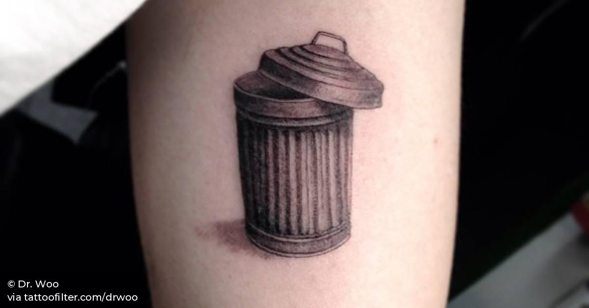 Rubbish bin tattoo on the inner arm.