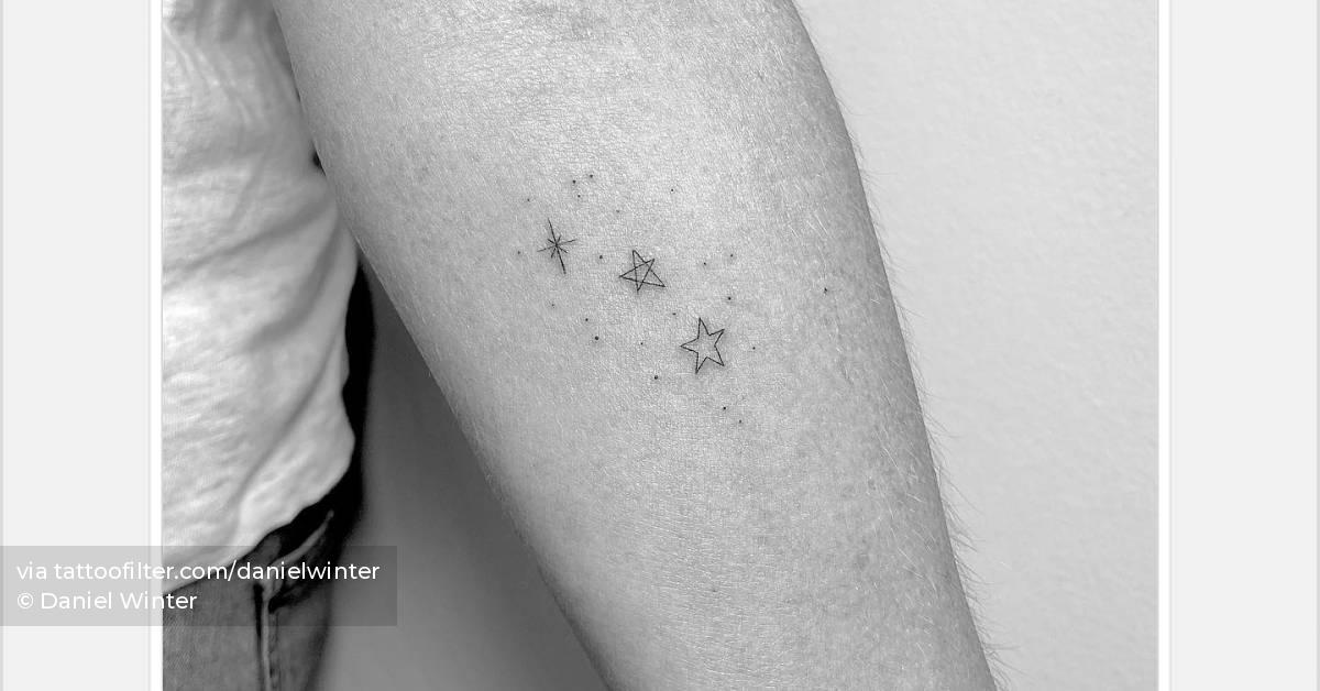 Fine line stars tattoo done on the inner forearm.