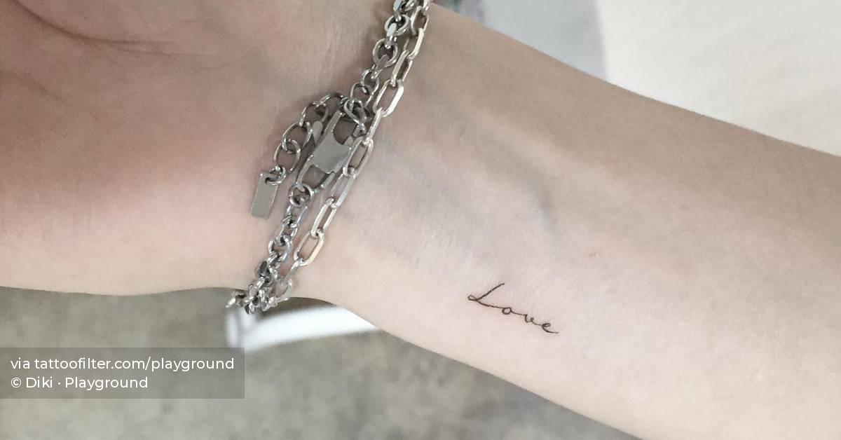 Lettering tattoo of the word "love" tattooed on the