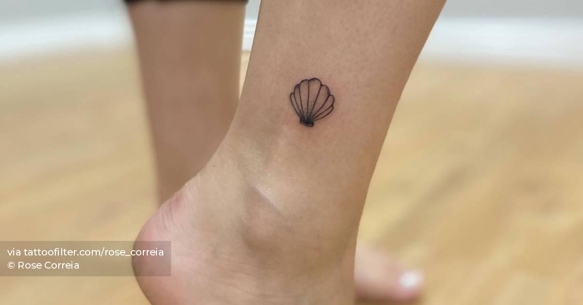 Minimalistic style shell tattooed on the ankle.