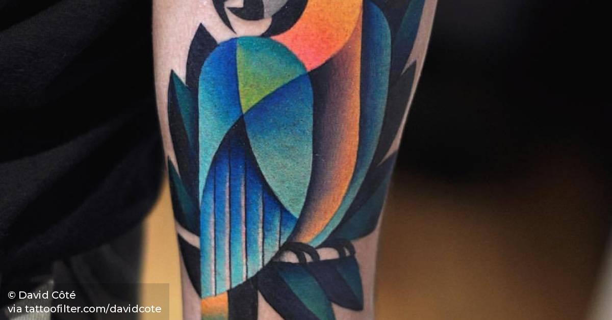 Macaw tattoo located on the inner forearm.