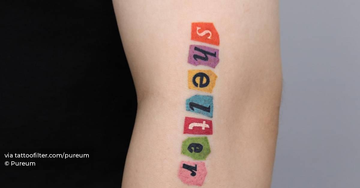 "Shelter" lettering tattoo located on the elbow,