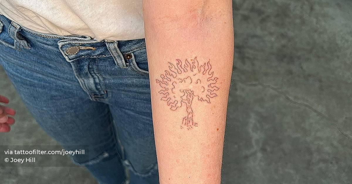 Fine line tree tattoo located on the inner forearm.