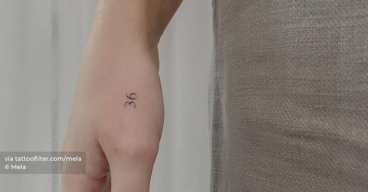 Tattoo of the number "36" done on the thumb.